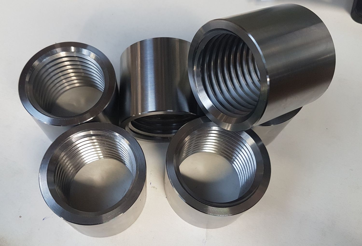 Round internally threaded nuts