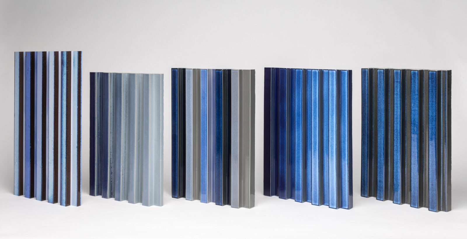 John Robertson Architects clads 1980s building with blue terracotta tiles