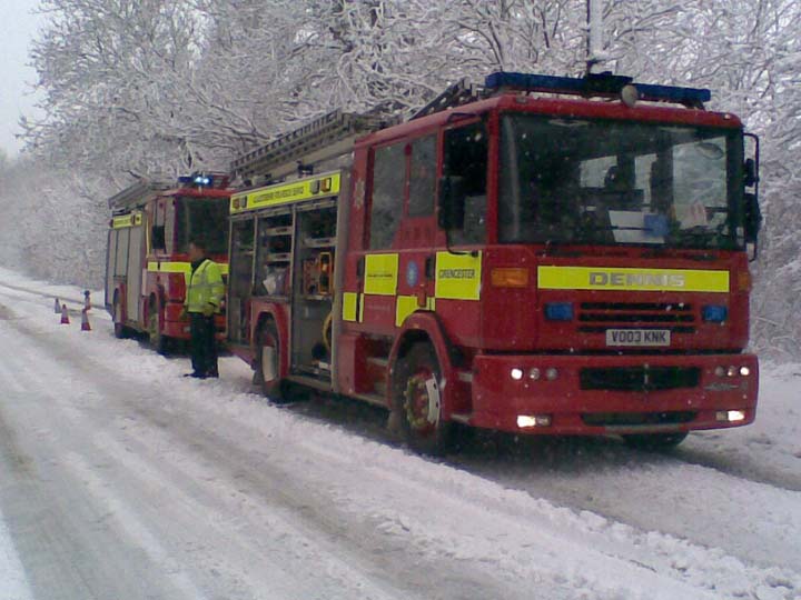 Fire Engines Photos - Fire fighting in the snow.