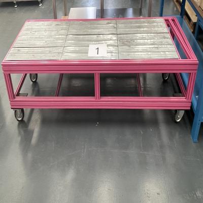 Lot 4 low pink workbenches with wheels