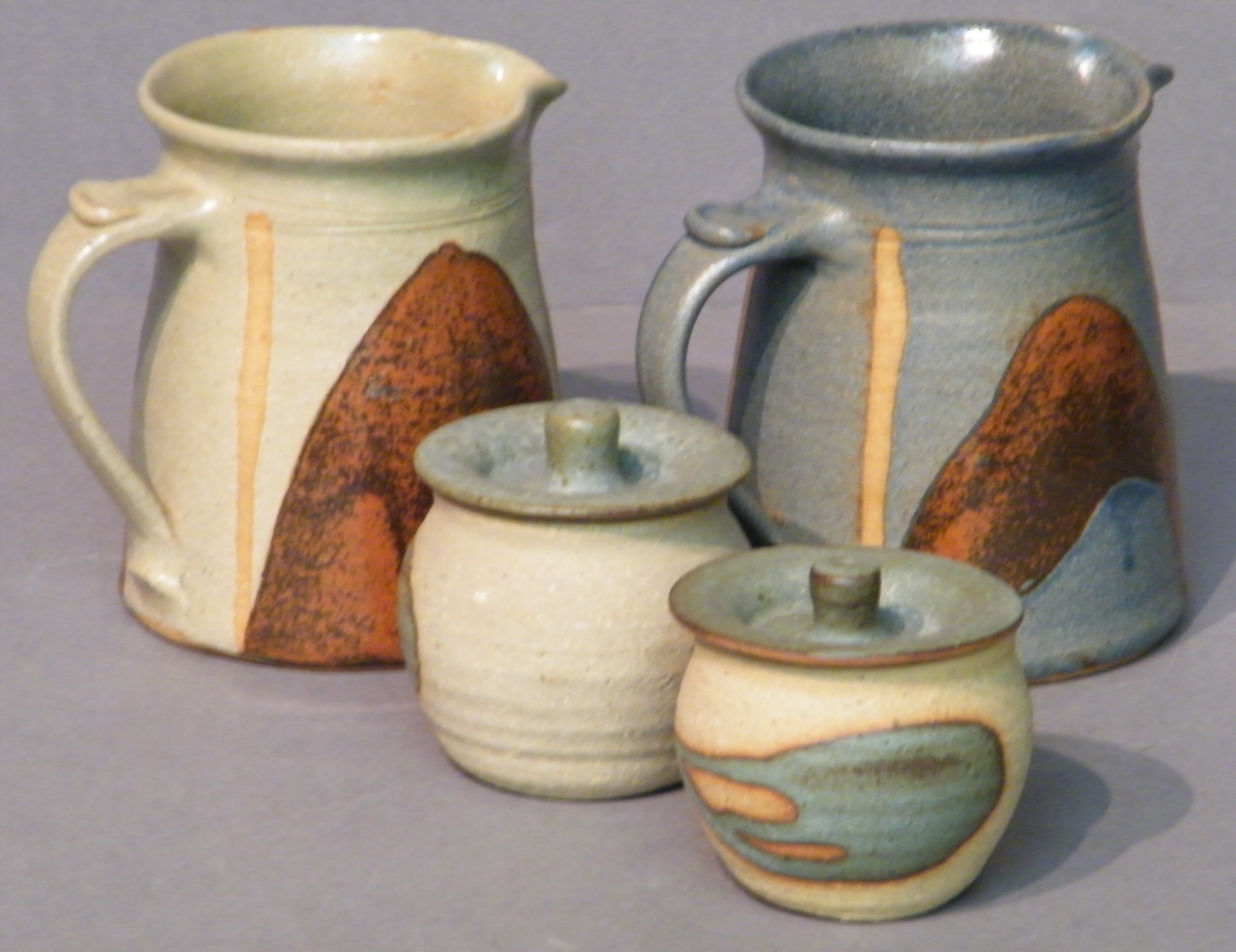 Two Alan Brough studio pottery jugs, height 11.5cm and two Alan Brough ...