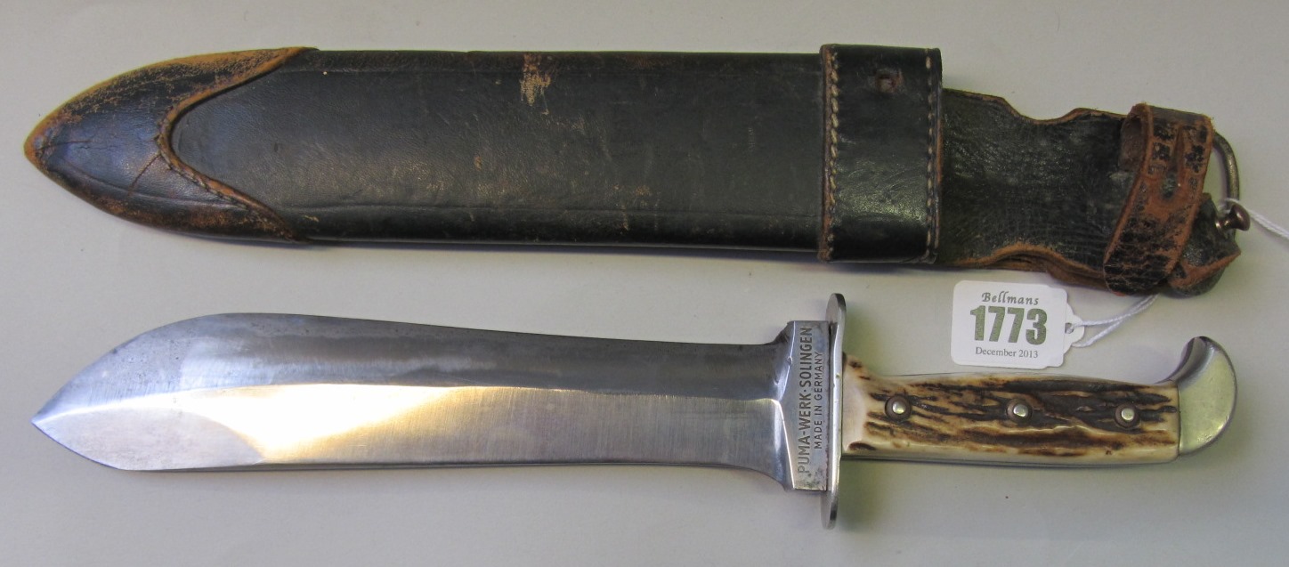 A German hunting knife, the single edged steel blade (21.5cm) stamped ...