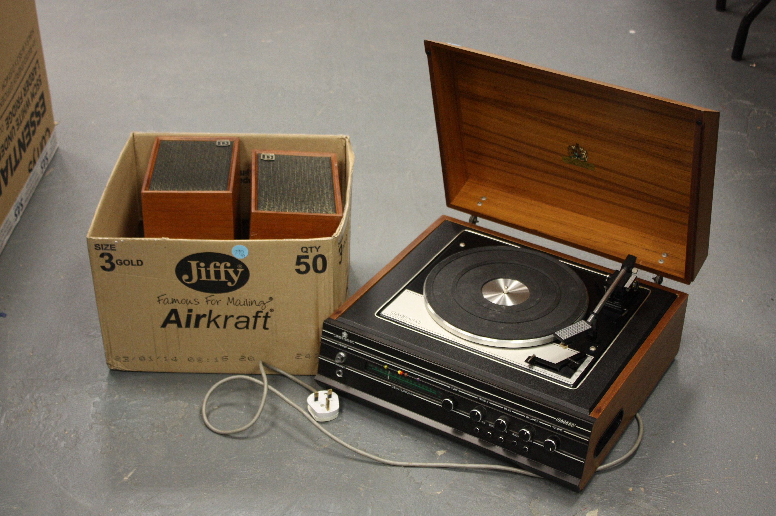 A Hacker Record Player, with Garrard SP25 Mk IV unit, together with two ...