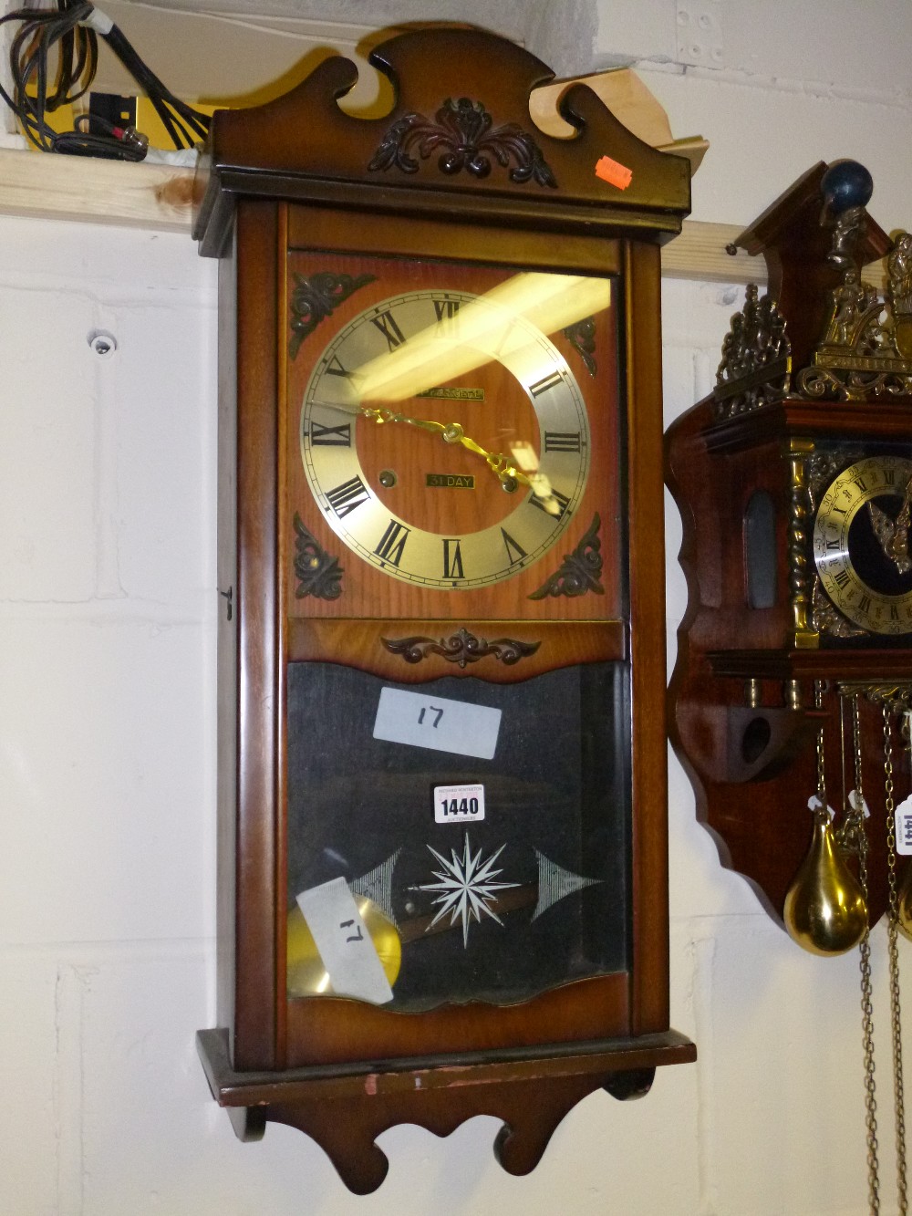 A President 31 day wall clock with key and pendulum