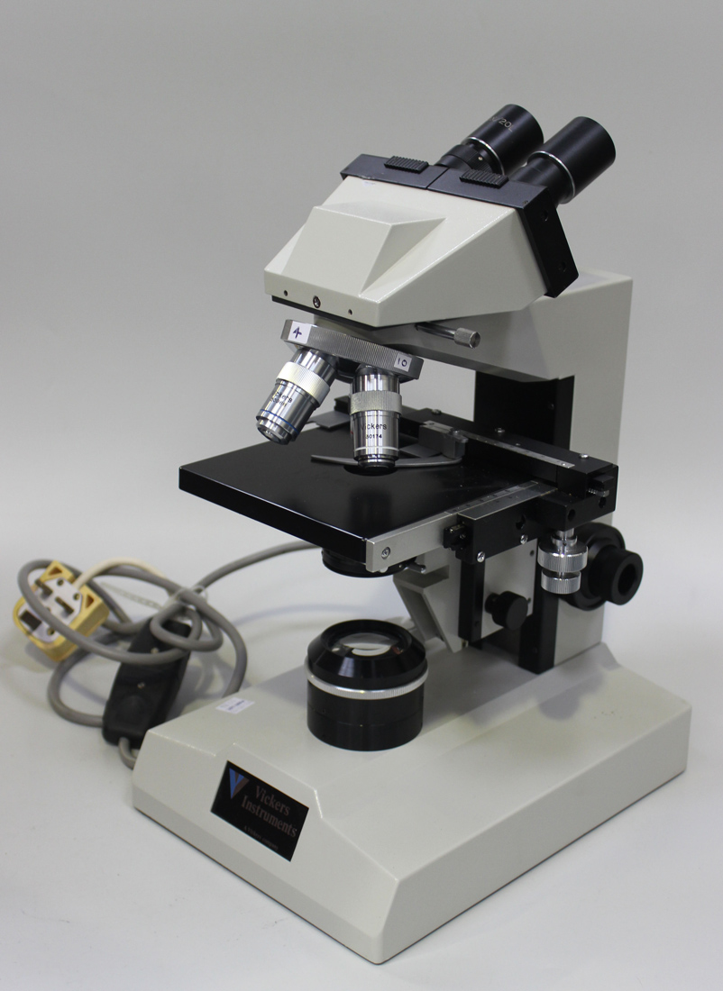 A Vickers instruments binocular microscope, model ML1300, boxed, and a ...