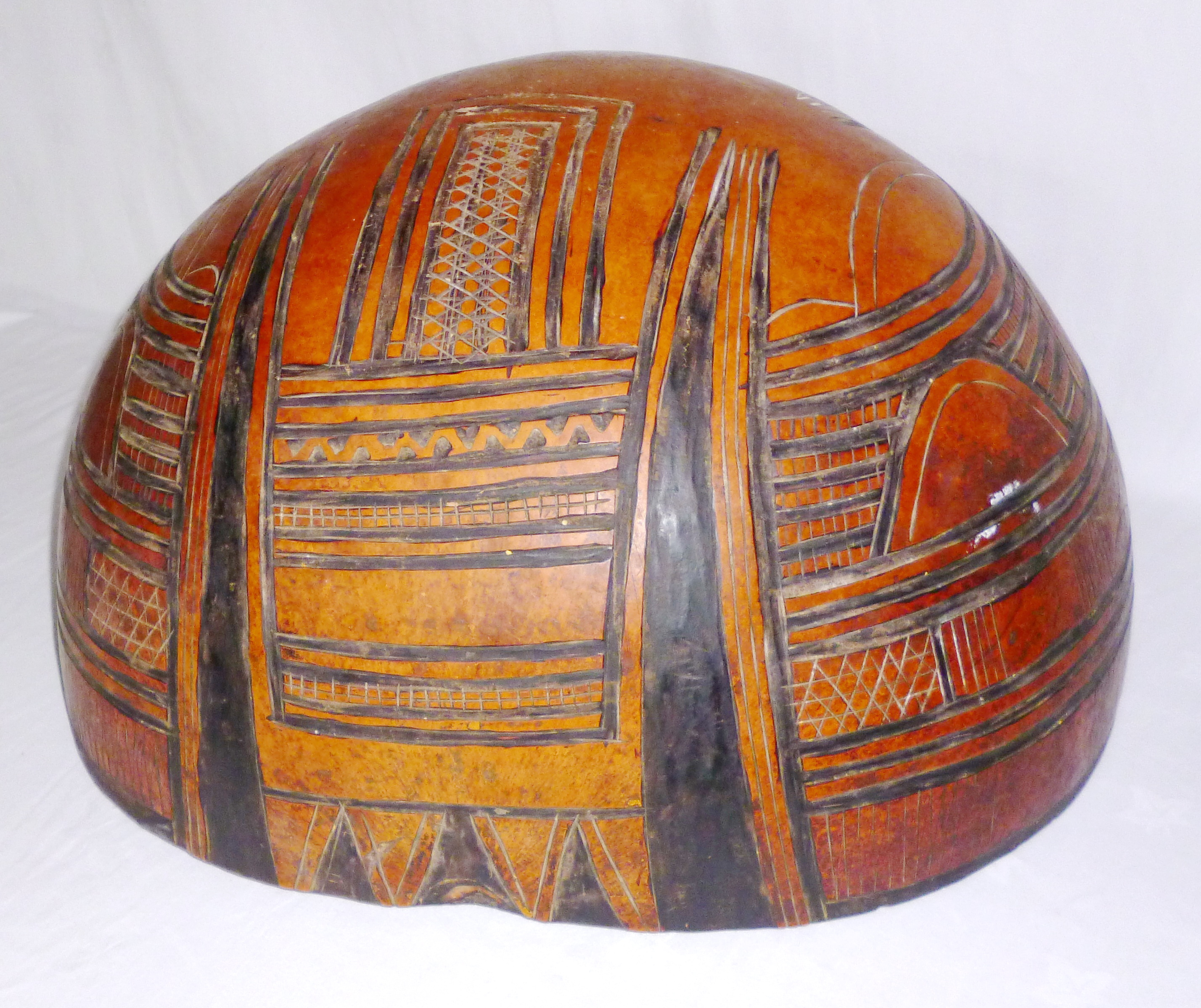 Large African calabash part painted and with incised geometric ...