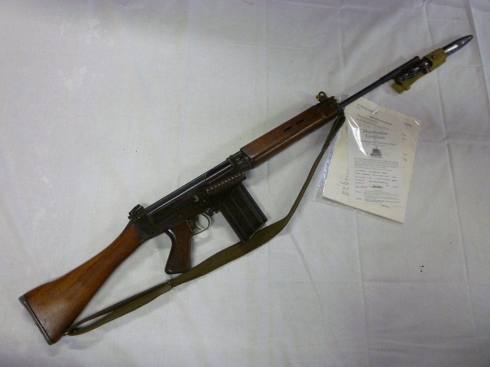 A deactivated British L1A1 Enfield 7.62 assault rifle together with ...
