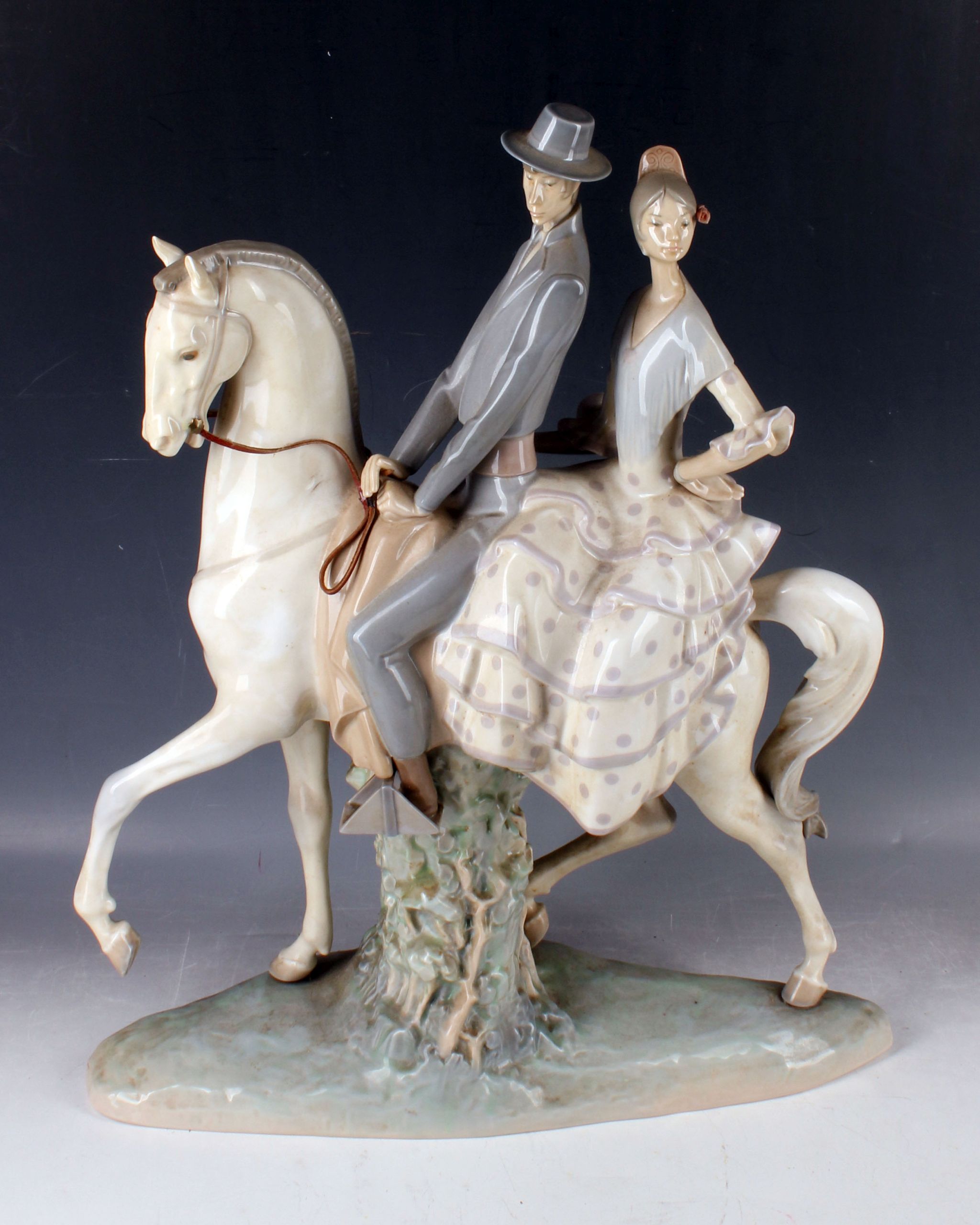 A Lladro large group, Andalusian man and woman on horseback, 43.5cm H.