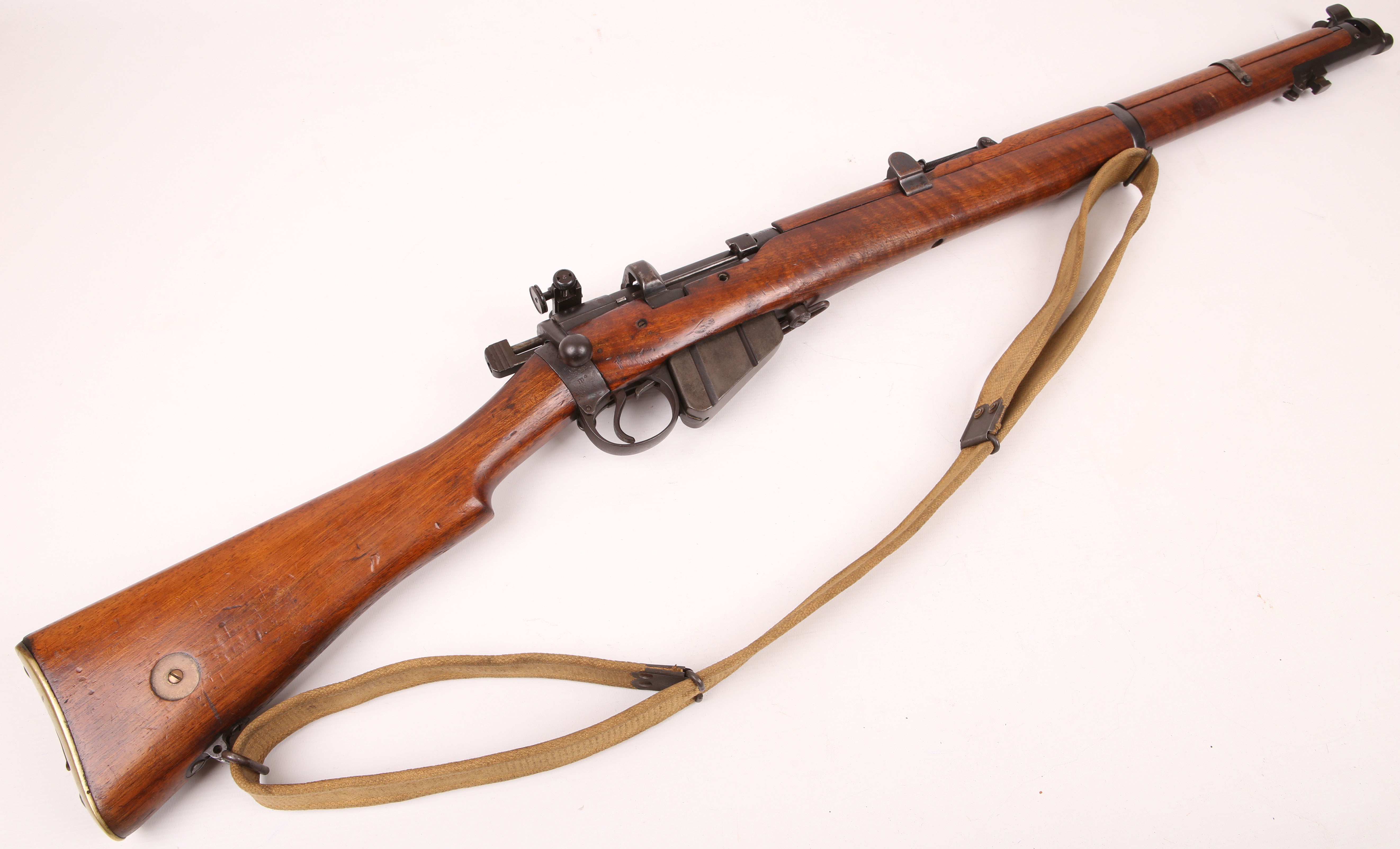 A short magazine Lee-Enfield MKIII (SMLE/303), walnut stock, stamped ...