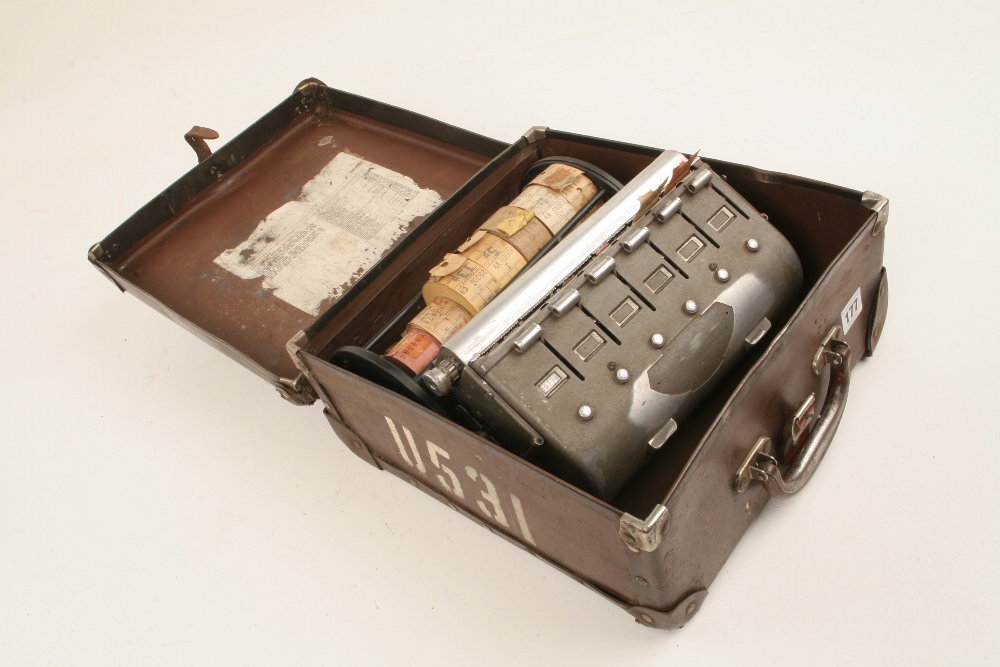 A bus conductors ticket machine with rolls of tickets in orig leather ...