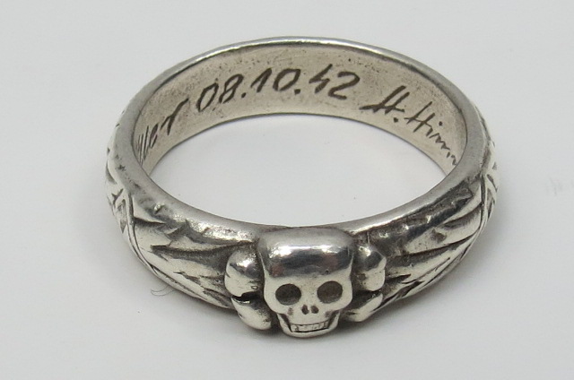 A fine quality reproduction of an original SS 'death head honour ring' bearing skull upon and the