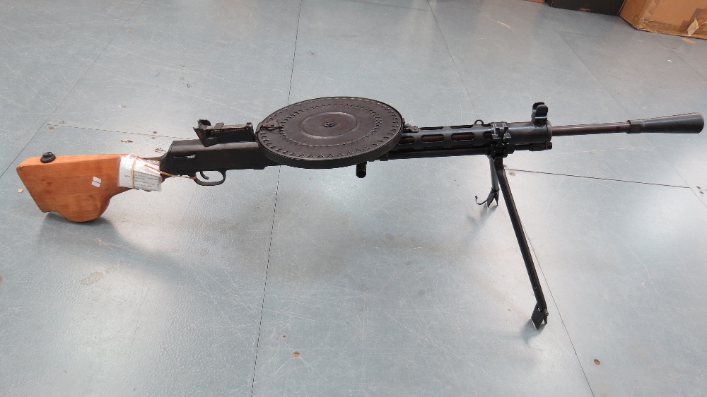 A deactivated, Russian DP 28, 7.62x54R calibre, light machine gun with pan magazine and retracta