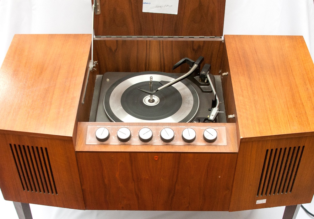 A 1970s HMV teak cased radiogram with Garrard record player fitted ...