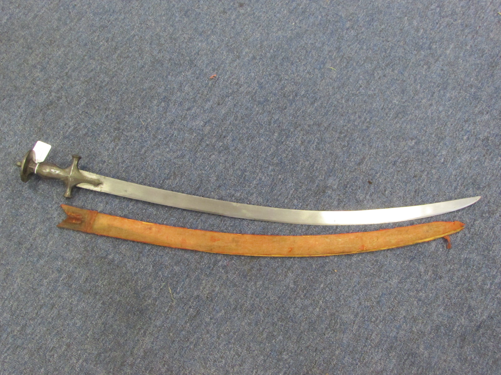 Indian sword: `Tulwar` iron hilt with long langets. Disc pommel. Curved ...