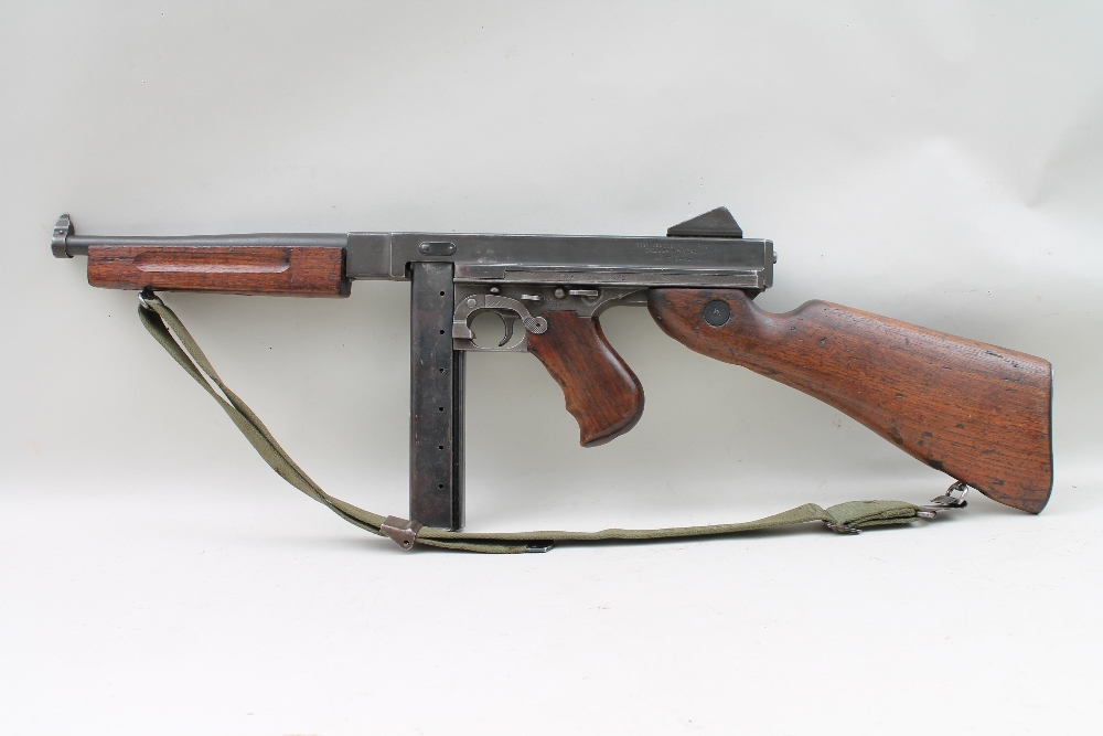 A deactivated Thompson machine gun, stamped `Thompson submachine gun ...