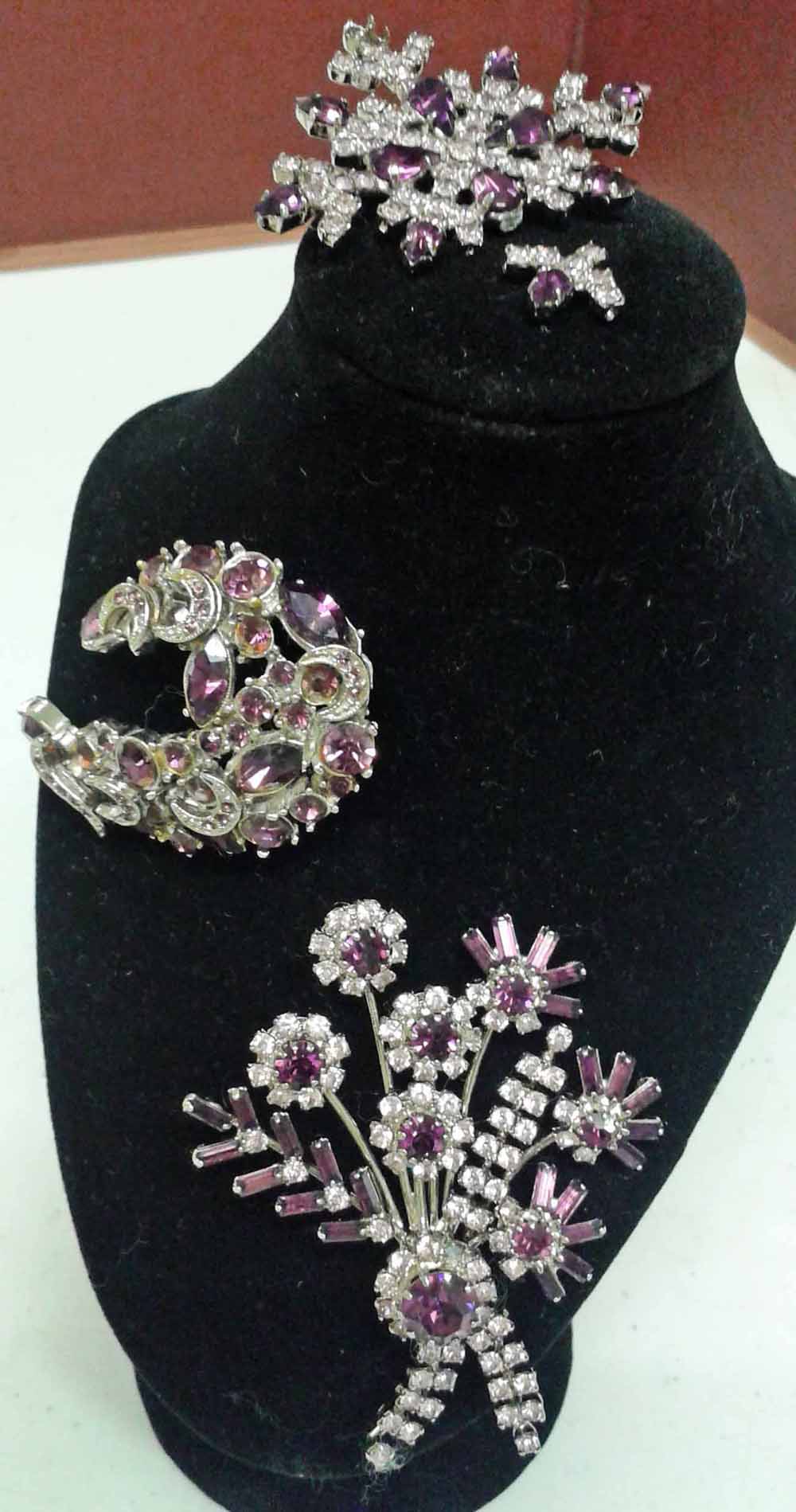 3 purple Sark Stone set brooches ~ 1 in need of repair.