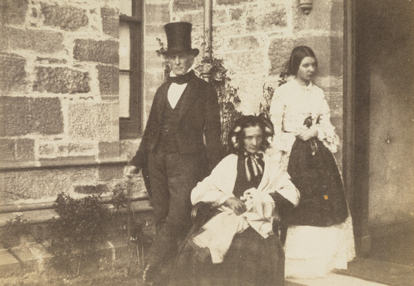 Rev. John Kirk, Mrs Kirk and Daughter at the Entrance of the Free Manse ...