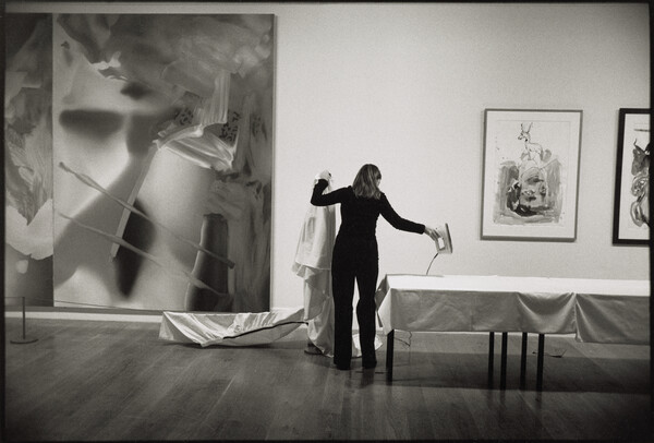 Susan Godfrey, Events Organiser, ironing a tablecloth in preparation ...