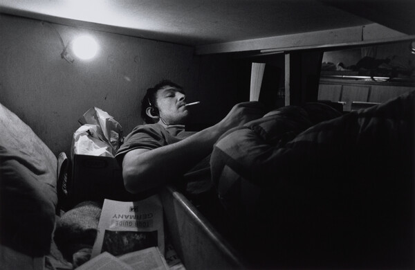 Stuart Kerr relaxes in his bunk at the end of the day, aboard the ...