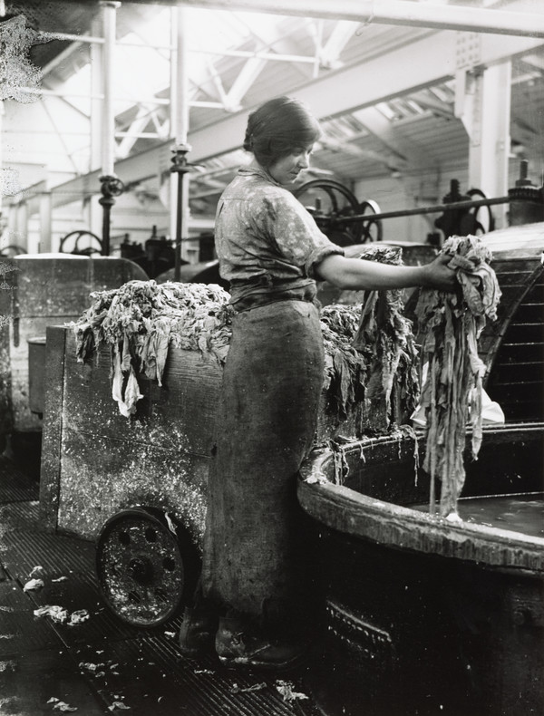 Feeding the rag breaking machine, unidentified paper mill by George P ...