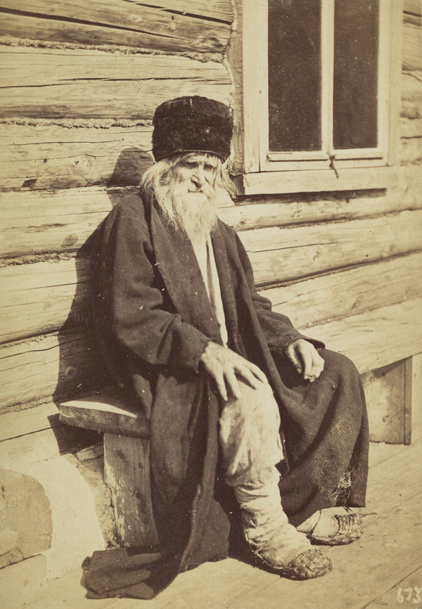 Old peasant man sitting on a wooden bench by William Carrick | National ...