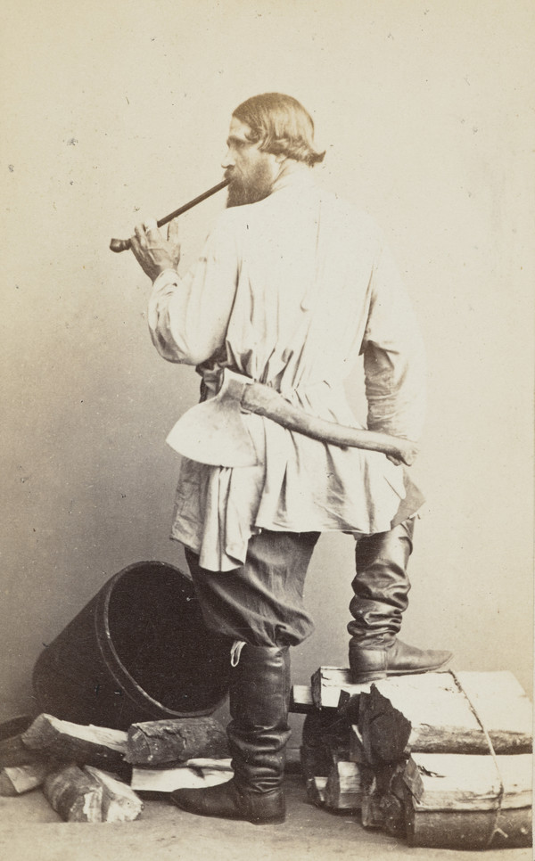 Woodcutter, standing with back to camera, seen in profile smoking a longstemmed pipe by William ...