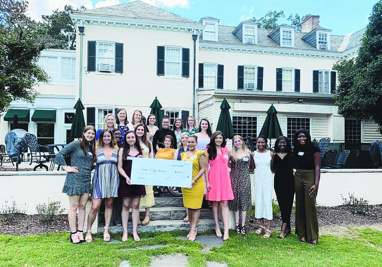 Members of the Aiken Junior Woman’s Club pose for a photo at a ...