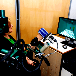 Subject performing assessments with the ARMin arm robot (Courtesy of ...