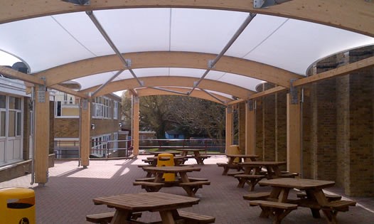 Free-Standing wide-span Canopies in Glulam Timber by Street Space Group